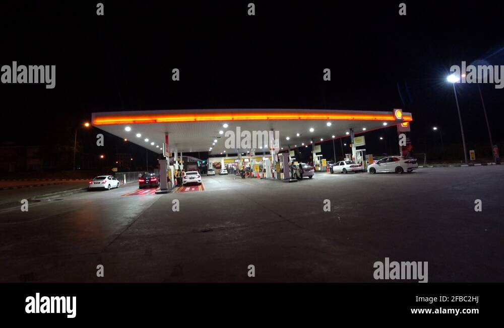 Shell petrol station at night. Customers come to visit this petrol ...