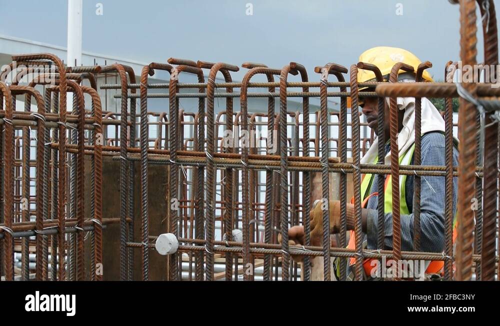 Construction workers fabricating steel reinforcement bar to form Stock ...