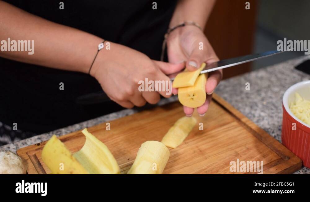 Cutting the plantain Stock Videos & Footage - HD and 4K Video Clips - Alamy