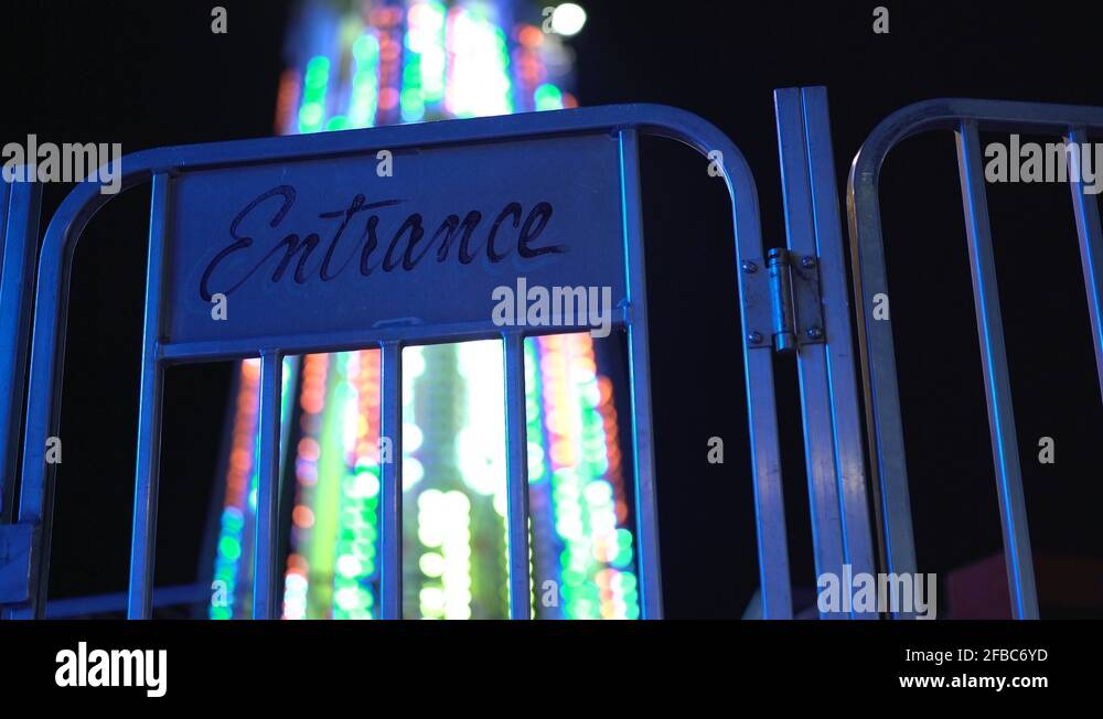 Entrance gate at carnival ride evening establishing 4k Stock Video ...