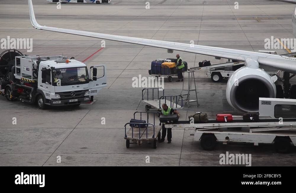 Loading and unloading baggage Stock Videos & Footage - HD and 4K Video ...