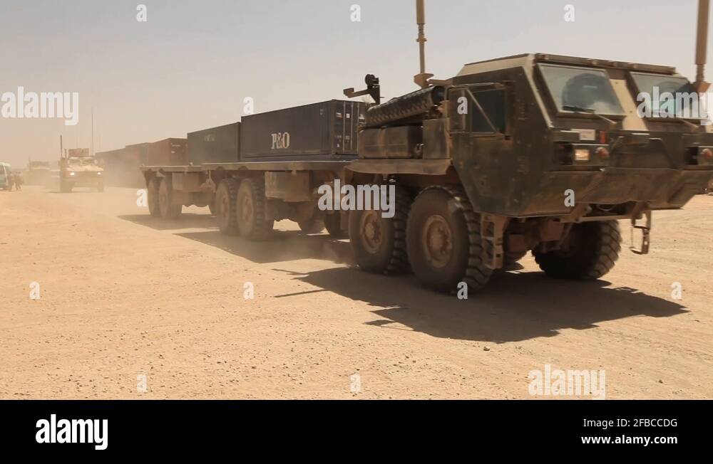 Marines maneuvering in military tactical vehicle at Camp Leatherneck ...