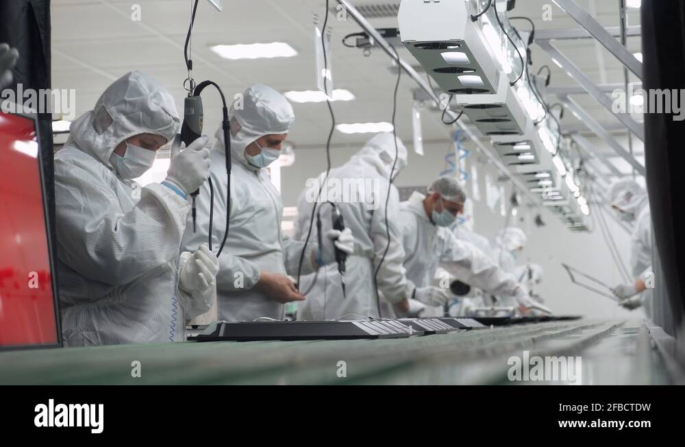 Innovative production of TVs, view of the assembly line, workers in ...