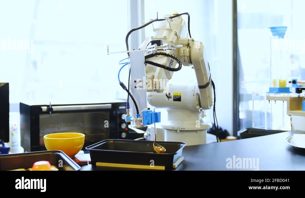 Robot arm cooking 4K Stock Video Footage - Alamy