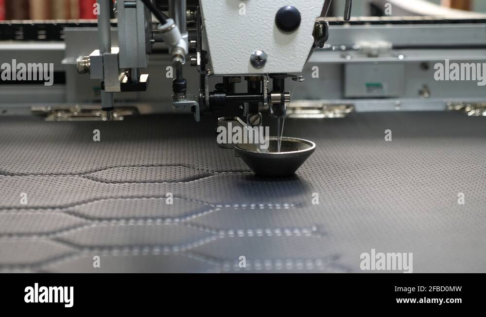 Robot sewing machine. automatic sewing machine. Robotics works in the ...