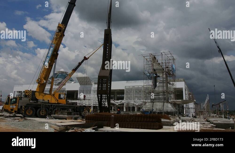 Mobile crane lifting heavy steel structure at the construction site ...