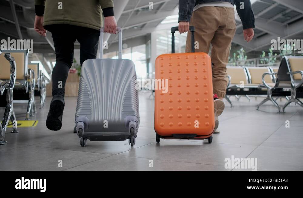 Rolling suitcase in airport Stock Videos & Footage - HD and 4K Video ...