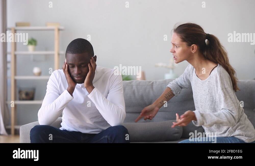Frustrated african husband tired of annoying angry caucasian wife ...