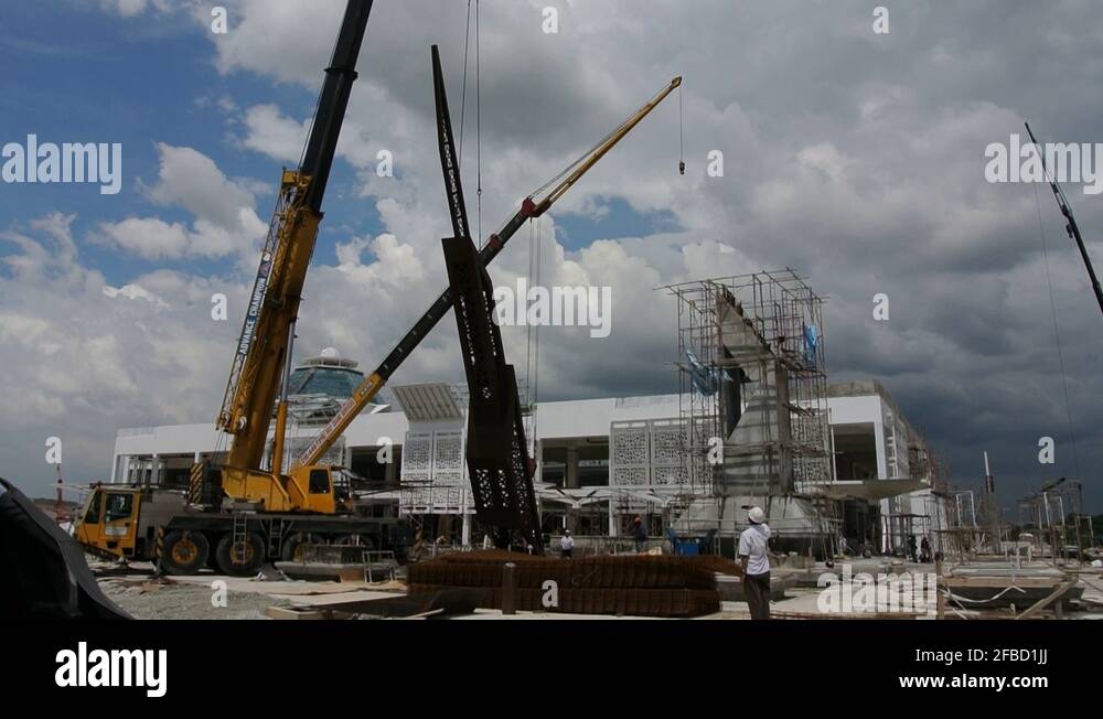 Mobile crane lifting heavy steel structure at the construction site ...
