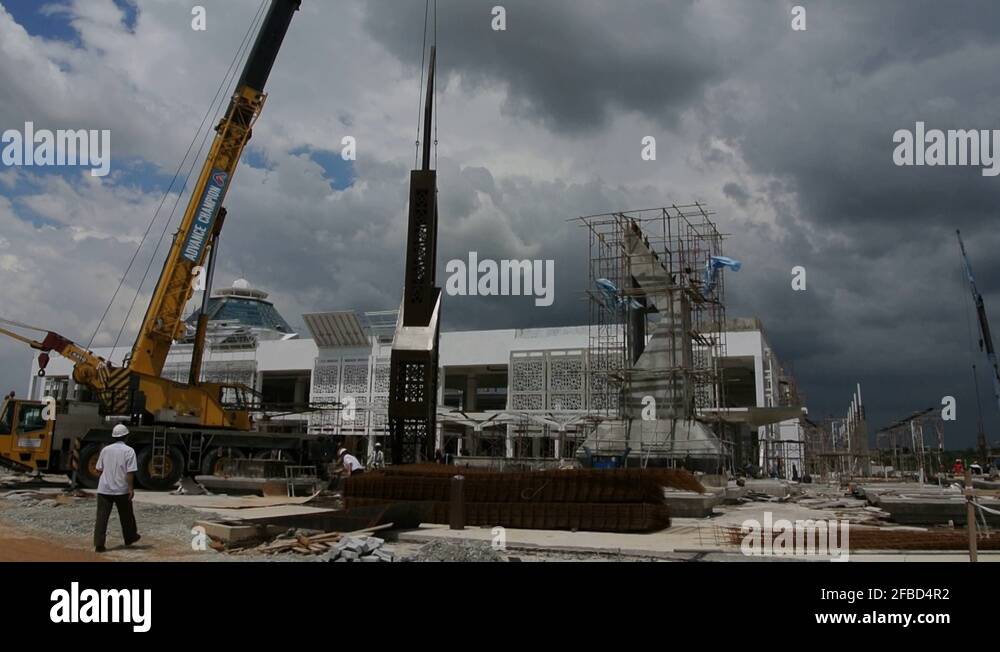 Mobile crane lifting heavy steel structure at the construction site ...