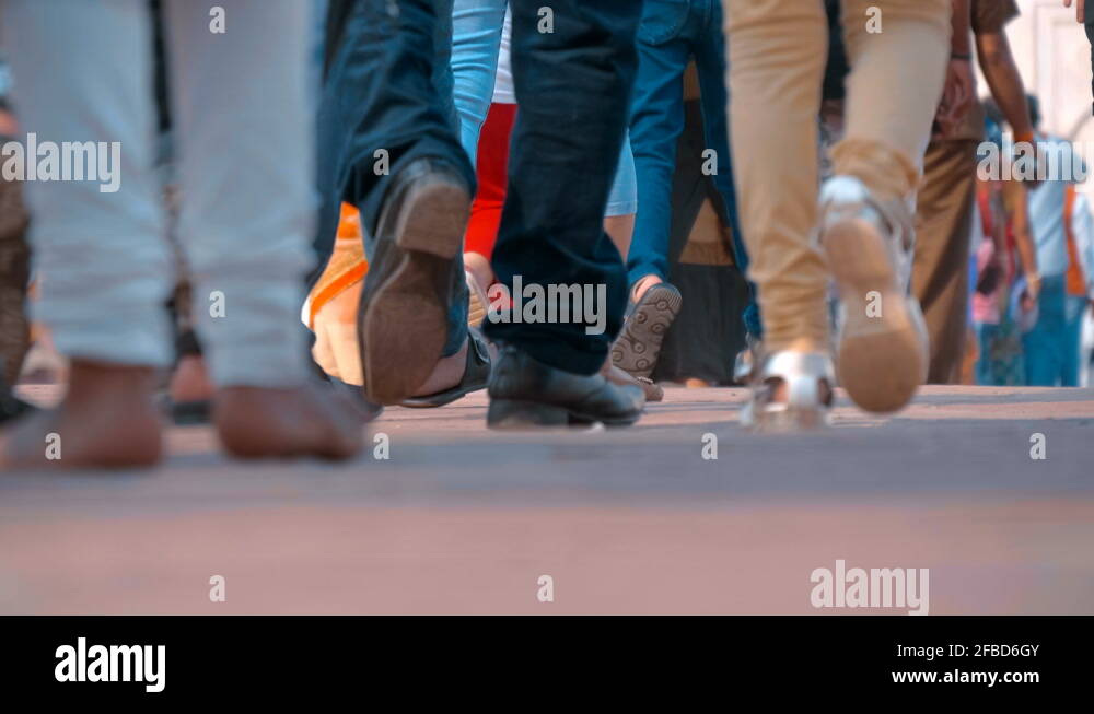 Feet without shoes of people dressed in colorful traditional Indian ...