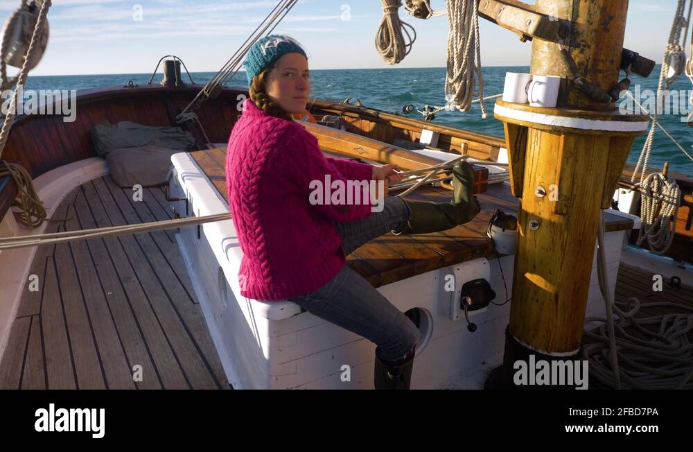 Female Sailor Pulling Rope Lines Tight Stock Video Footage - Alamy