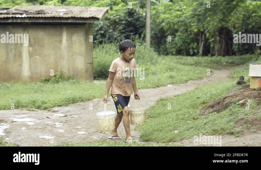 Boy carrying two buckets Stock Videos & Footage - HD and 4K Video Clips ...