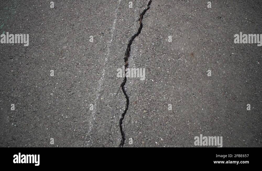 Broken road with cracks in the road surface Stock Videos & Footage - HD ...