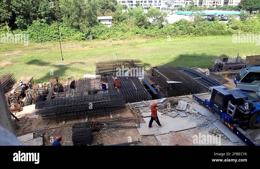 Construction workers working at the steel reinforcement bar bending ...