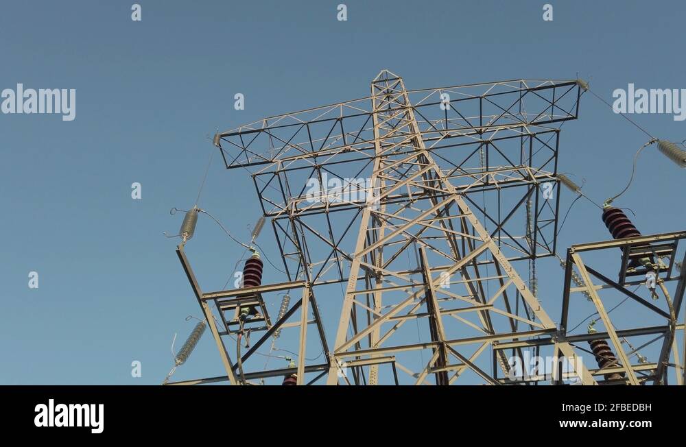 Rotating upward perspective view on high voltage electrical pylon set ...