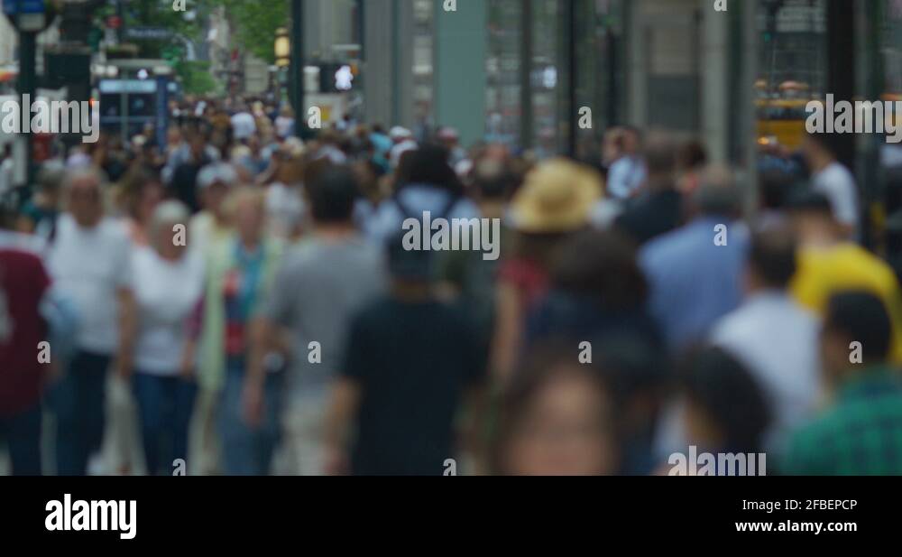 Crowd of people walking street slow motion backlit New York City slow ...