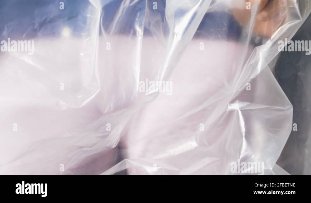 Woman inside a plastic bag. Concept of plastic pollution Stock Video ...