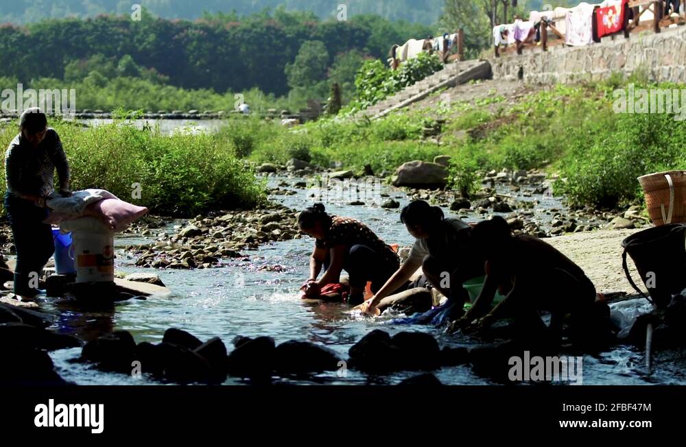 Women washing clothes in the river Stock Videos & Footage - HD and 4K ...