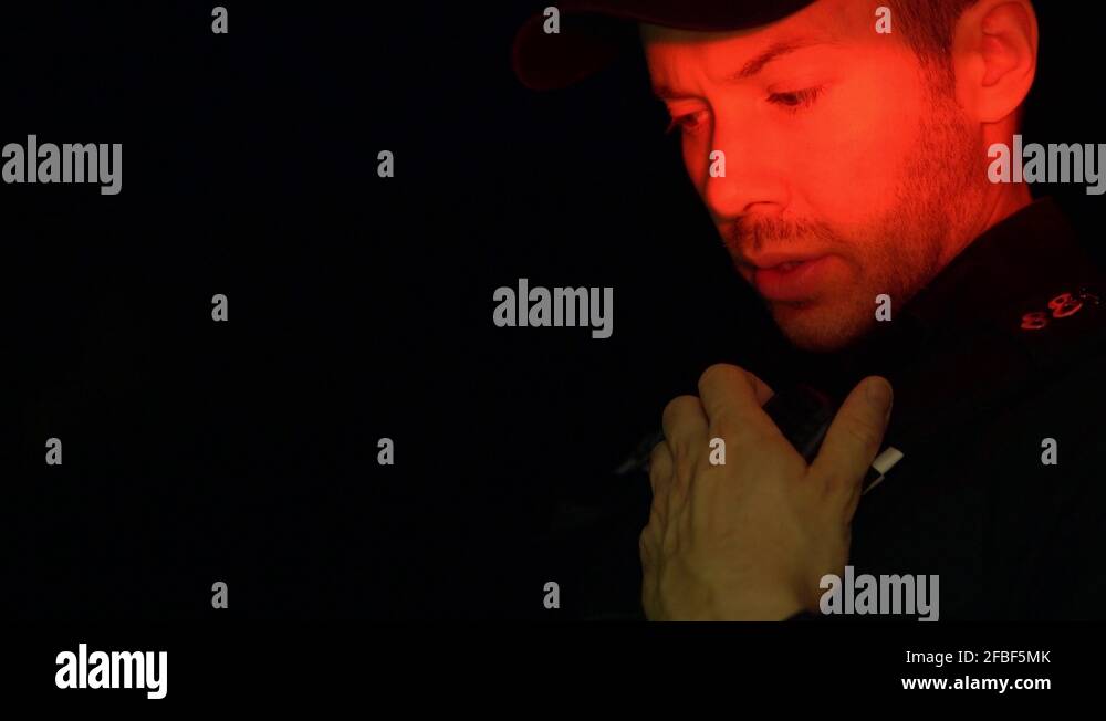 Male Police Officer Using Radio To Run License Plate Number Stock Video ...