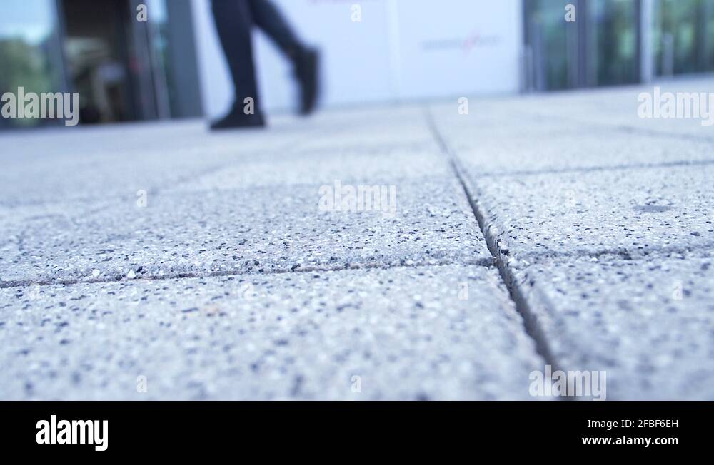 Extreme low angle shot with narrow depth of field showing people in the ...