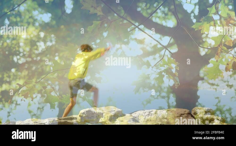 Man jumping on rocks on top of a mountatin 4k Stock Video Footage - Alamy