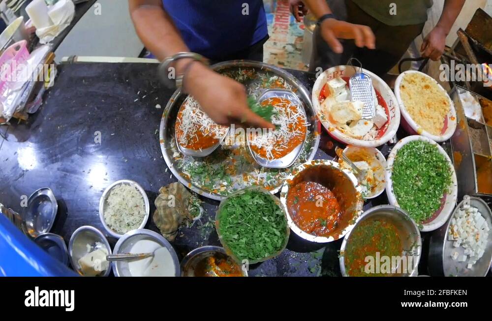 Chef prepares an Indian dish on a messy and unorganized counter Stock ...