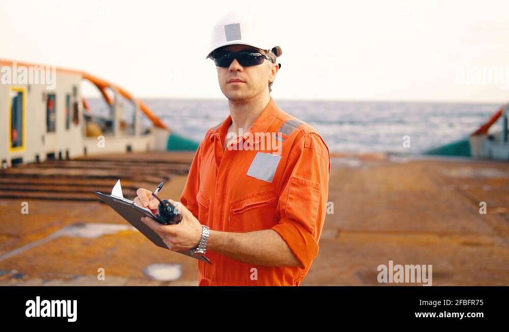 chief officer on deck of ship or vessel with checklist Stock Video ...