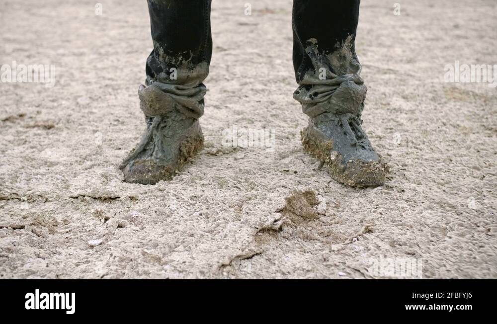 Boots in mud Stock Videos & Footage - HD and 4K Video Clips - Alamy