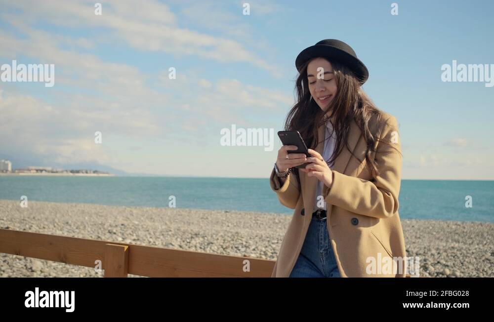 Girl hanging out on beach in daylight alone Stock Video Footage - Alamy