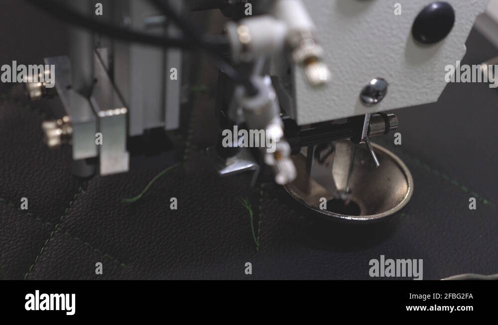 Robot sewing machine. automatic sewing machine. Robotics works in the ...