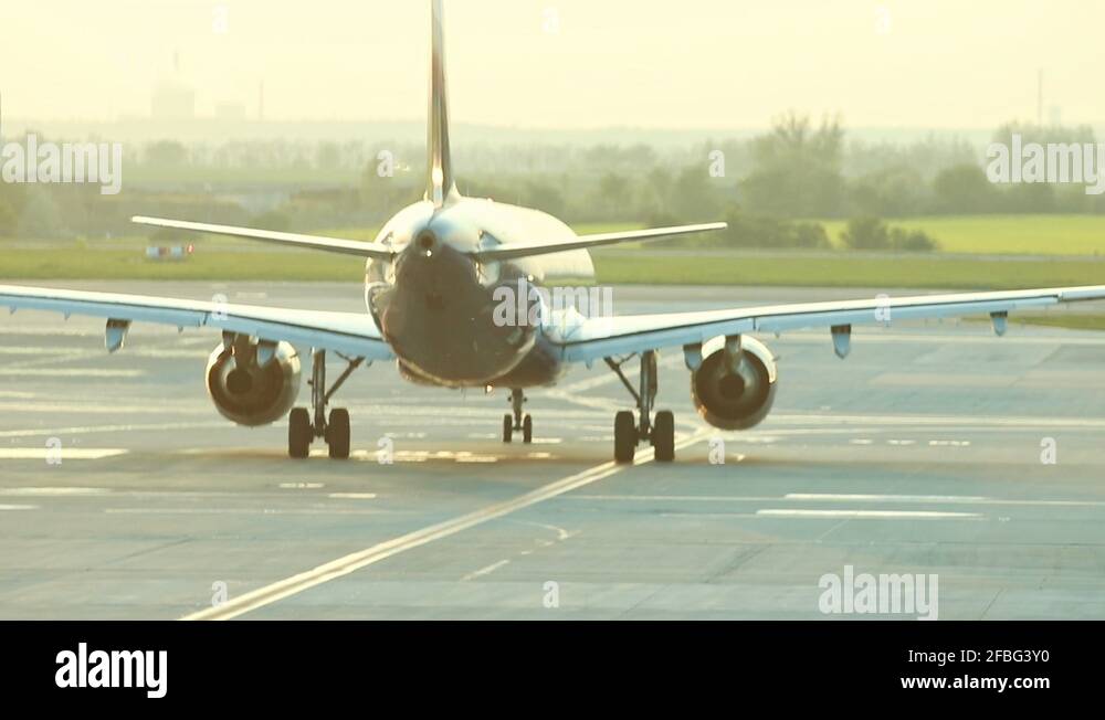 A huge plane standing on the airport field and about to fly Stock Video ...