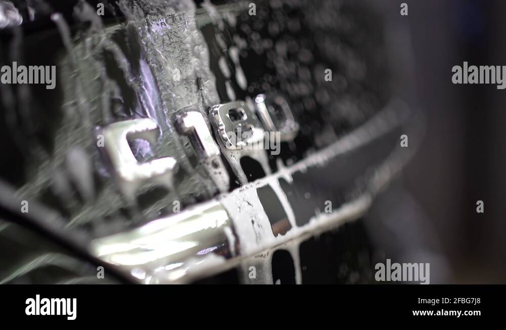 Foam running through the back exterior of a Black Mercedes c180 logo in ...