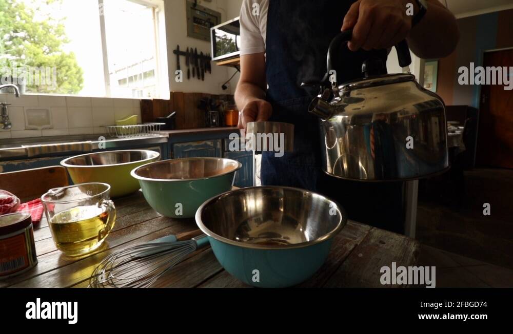 Close up footage of a chef sifting ingredients together to back a Stock ...