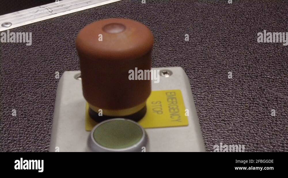 Emergency Stop. An engineer pressing emergency stop button. Warning ...