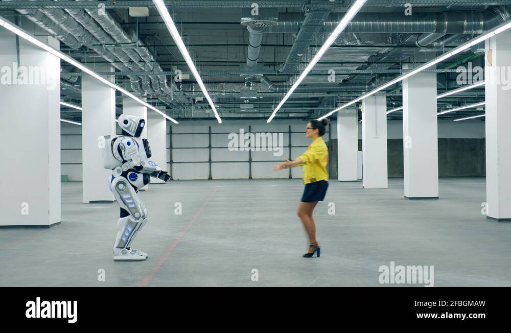 A woman hugs meets her friend robot, hugging it Stock Video Footage - Alamy