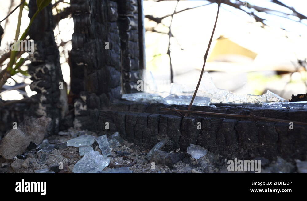 Black charred broken window of building destroyed by fire Stock Video ...