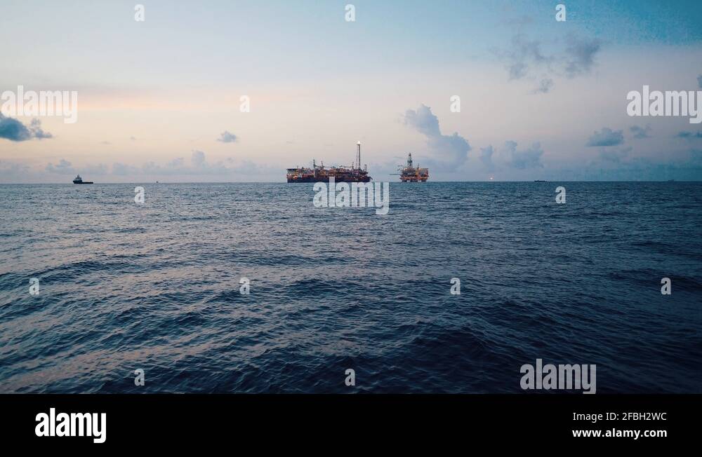FPSO tanker vessel near Oil platform Rig Stock Video Footage - Alamy