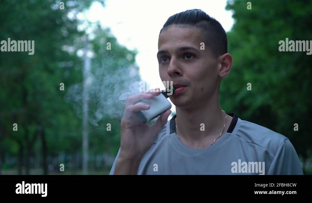 Man vaping in street Stock Videos & Footage - HD and 4K Video Clips - Alamy