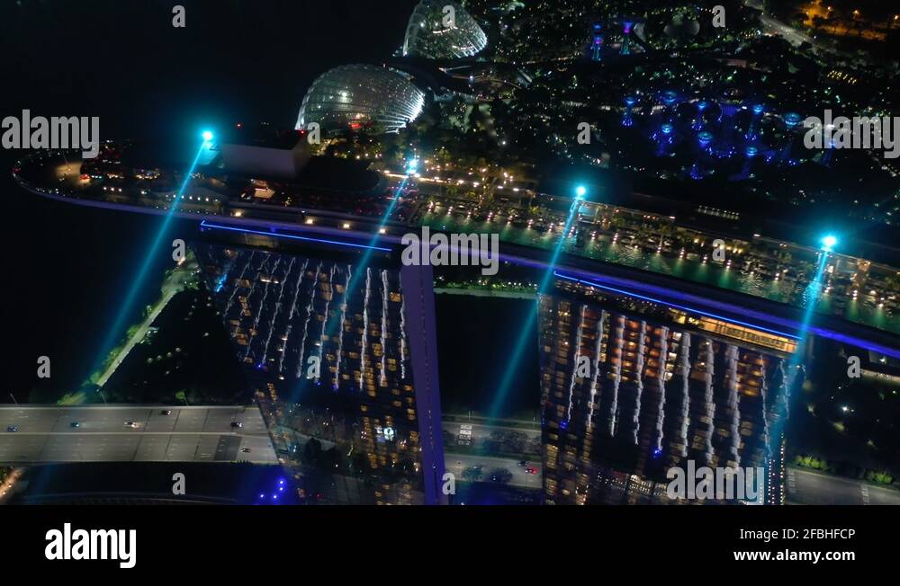 night singapore marina bay hotel rooftop swimming pool aerial panorama ...