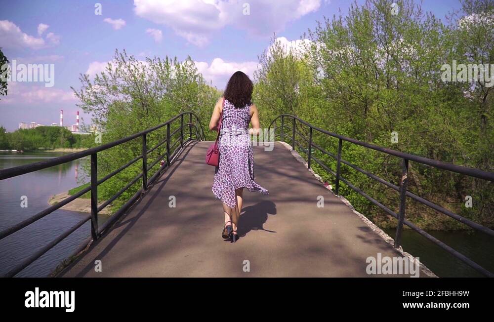 Woman walking away from camera Stock Videos & Footage - HD and 4K Video ...