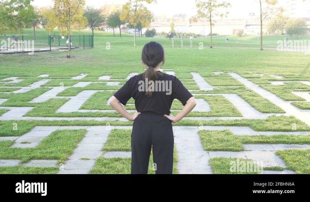 Teenager girl in maze..It shows thoughtfulness before choosing the life ...
