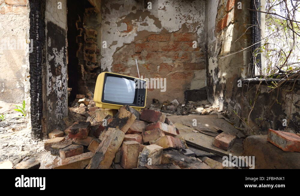 Retro TV with glitch television screen on broken bricks in destroyed ...