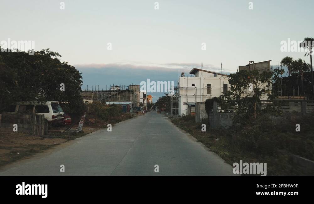 Driving away view on a rural road in the Philippines. Driving through a ...