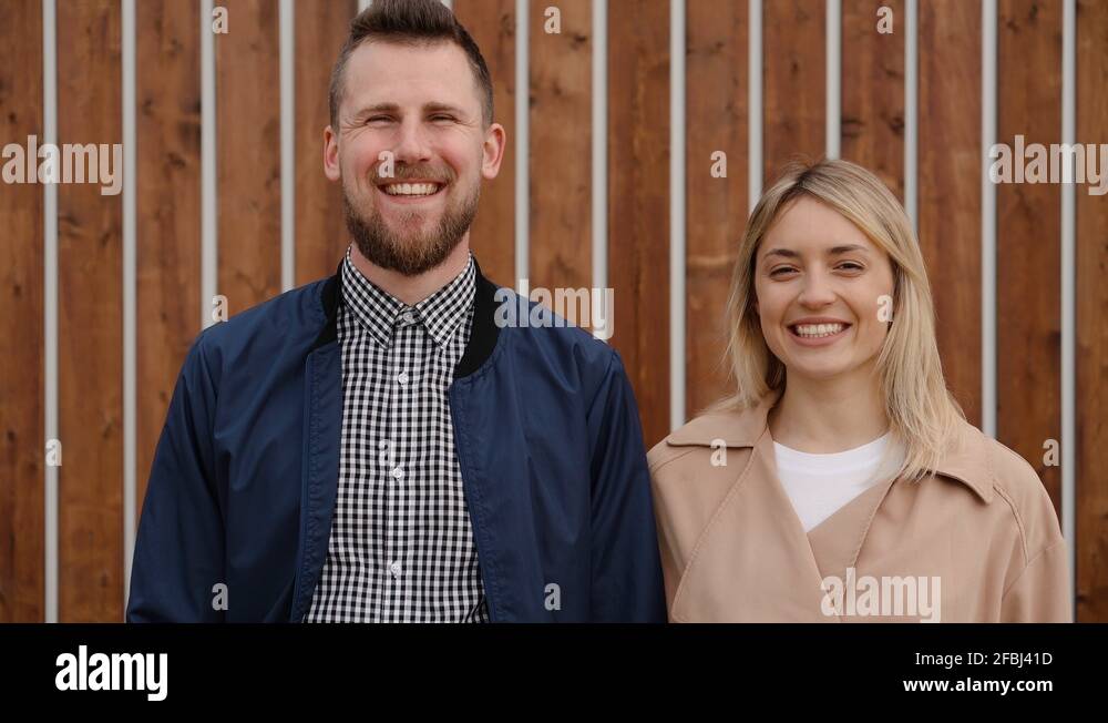Friendly couple smiling standing next to each other Stock Video Footage ...
