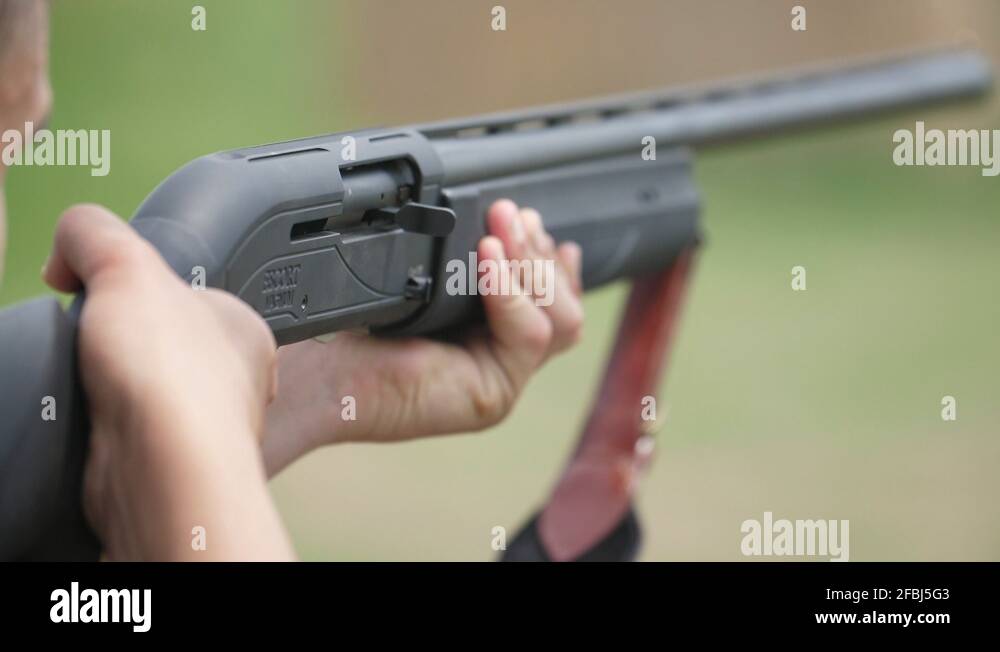 Modern shotgun firing and a cartridge case falling out breaching lock ...