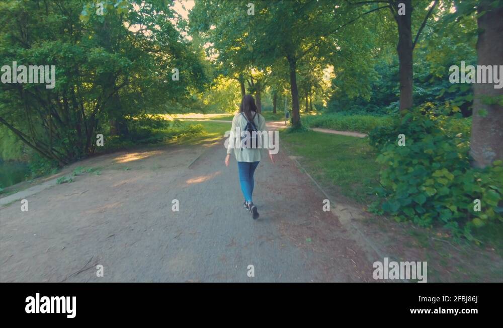 Woman walking through sunny park Stock Videos & Footage - HD and 4K ...