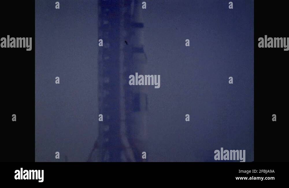 1960s: UNITED STATES: rocket launches from gantry. Heat and light ...