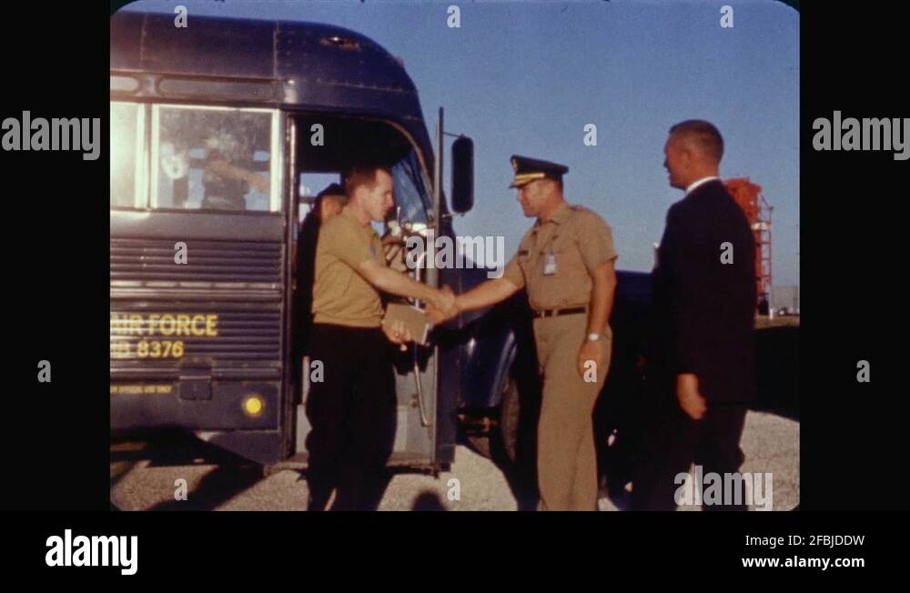 1960s: UNITED STATES: Air Force men shake hands by bus. Rescue team ...