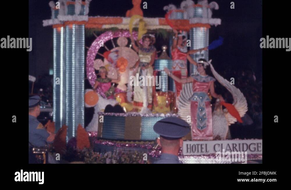 1960s: Women in costume wave from parade float. Miss Missouri waves ...